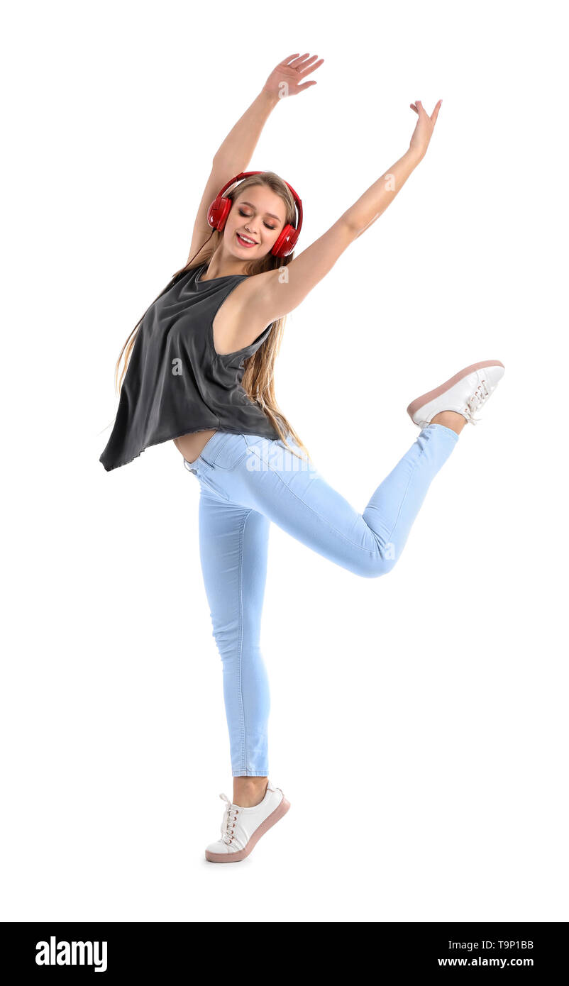 Beautiful young woman dancing on white background Stock Photo - Alamy