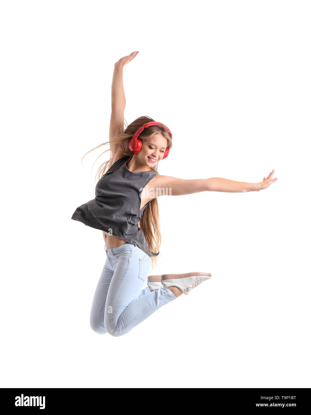 Jumping female dancer on white background Stock Photo - Alamy