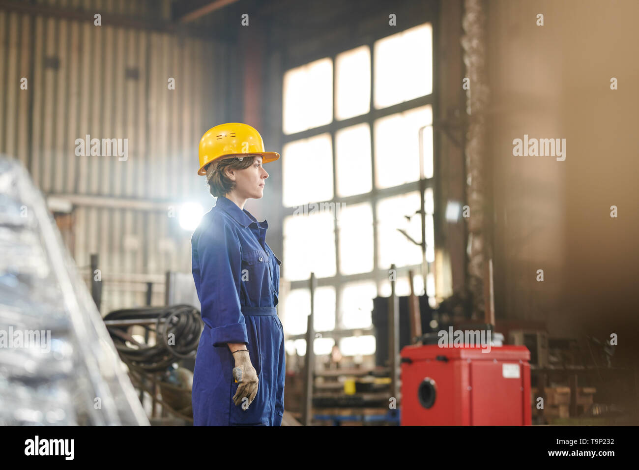 Female Worker Side View Stock Photo - Alamy