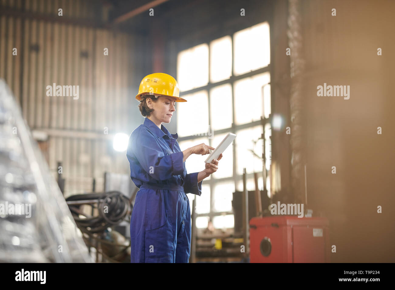 Modern Female Worker Side View Stock Photo - Alamy