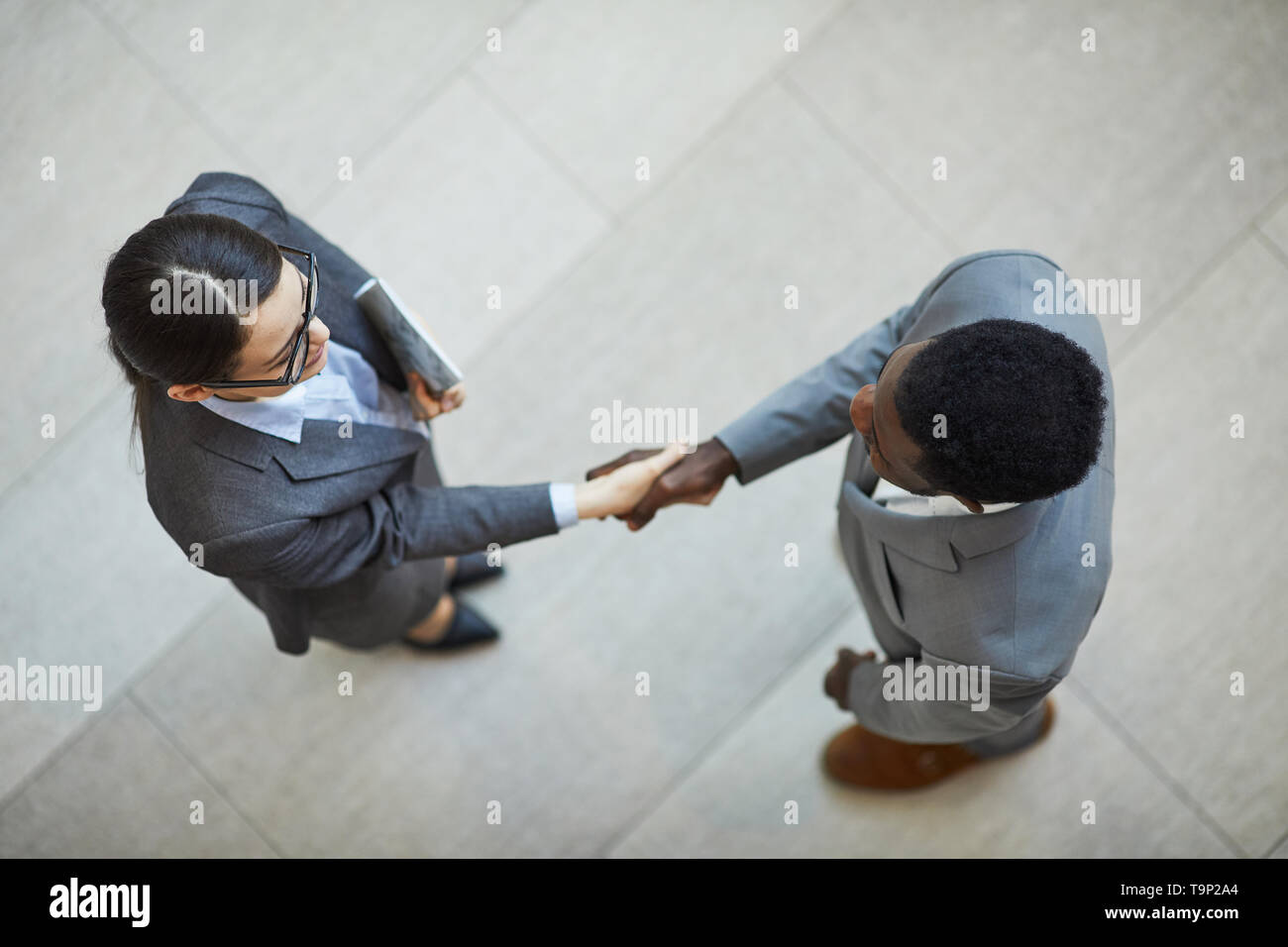 Shaking hands with new business partner Stock Photo - Alamy