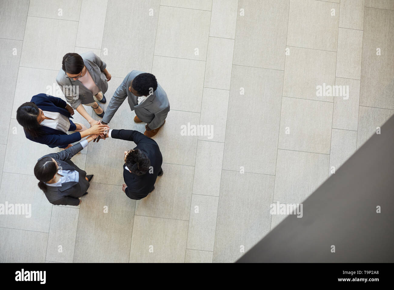 Business team stacking hands together Stock Photo - Alamy