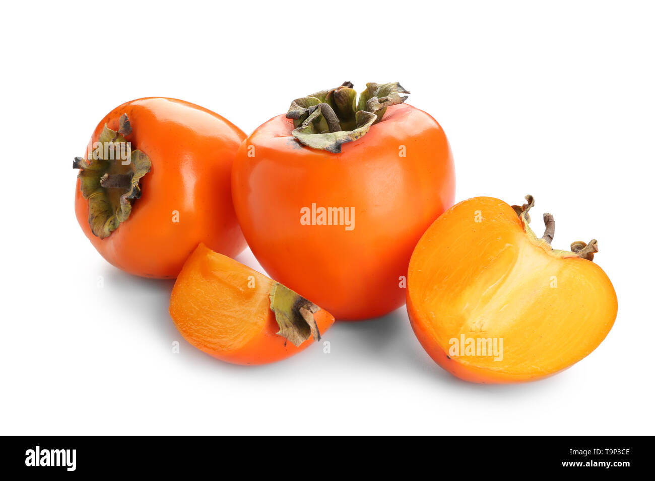 Ripe persimmons on white background Stock Photo - Alamy