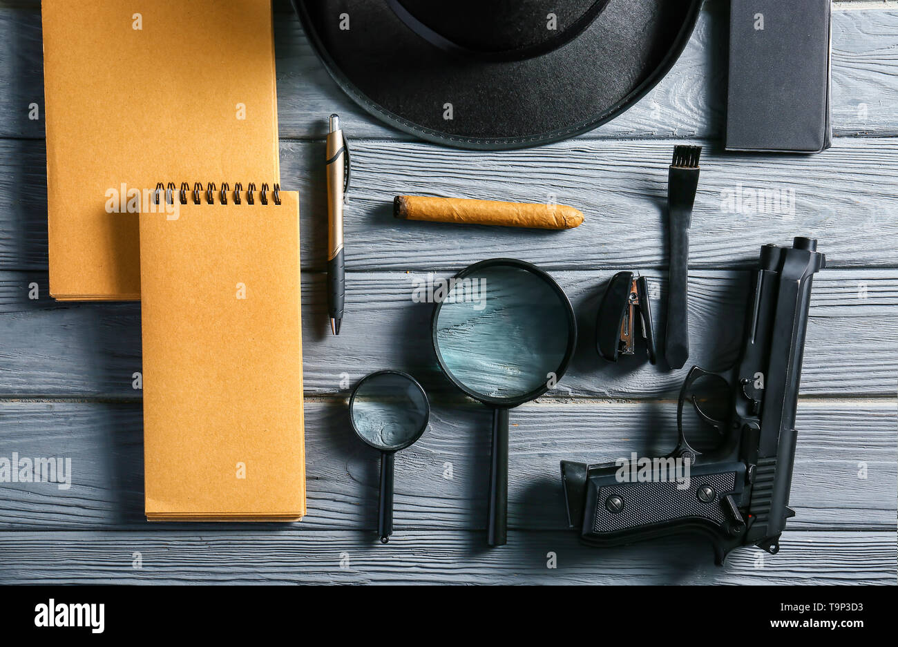Composition with different items for detective on wooden background ...