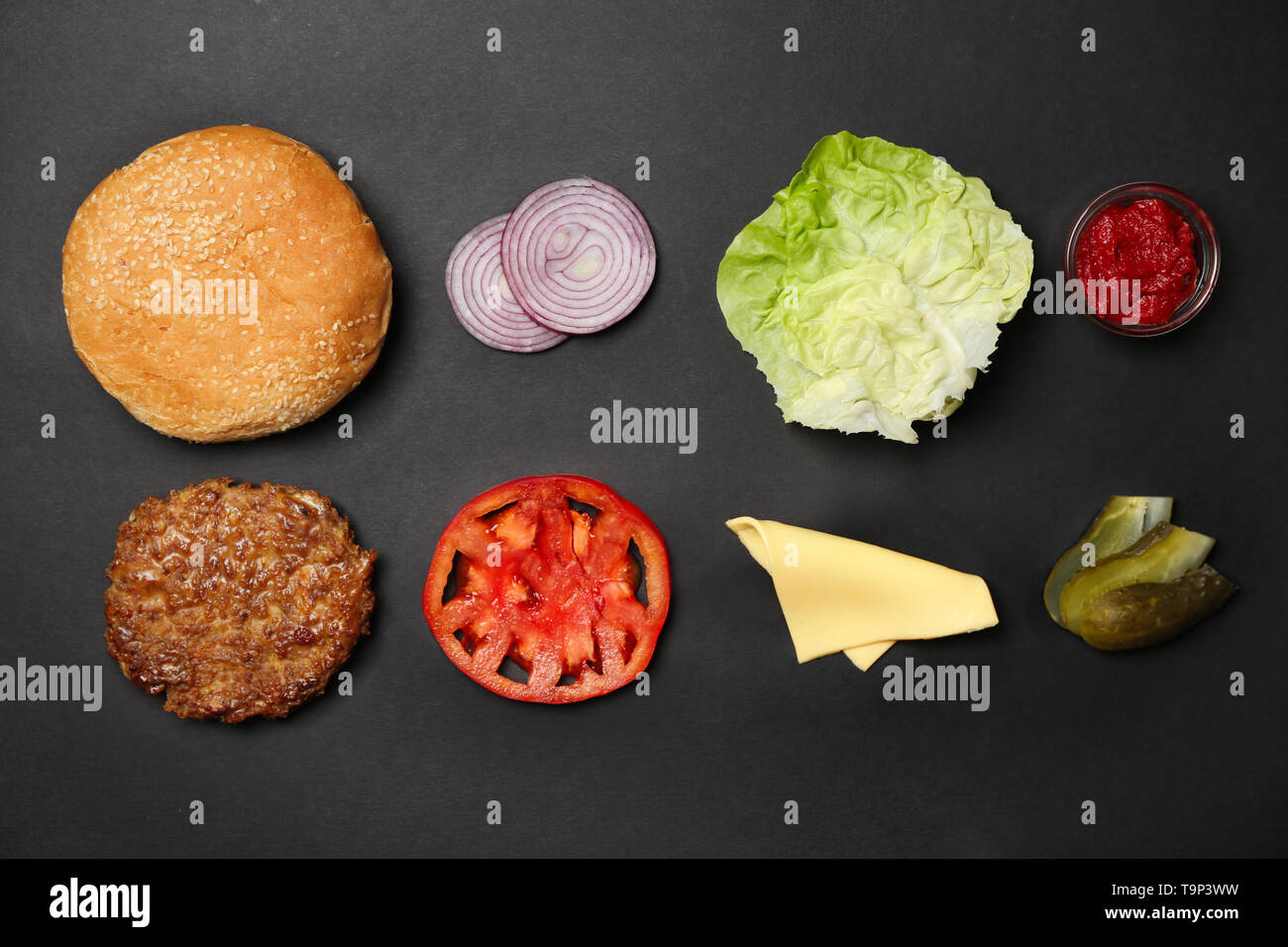 Ingredients for burger on black background, flat lay Stock Photo - Alamy