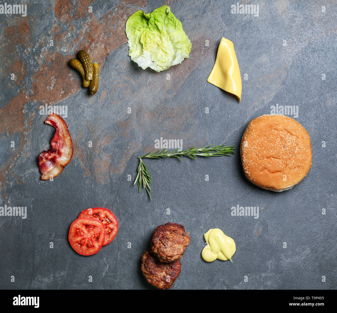 Flat lay composition with ingredients for burger on grey background ...