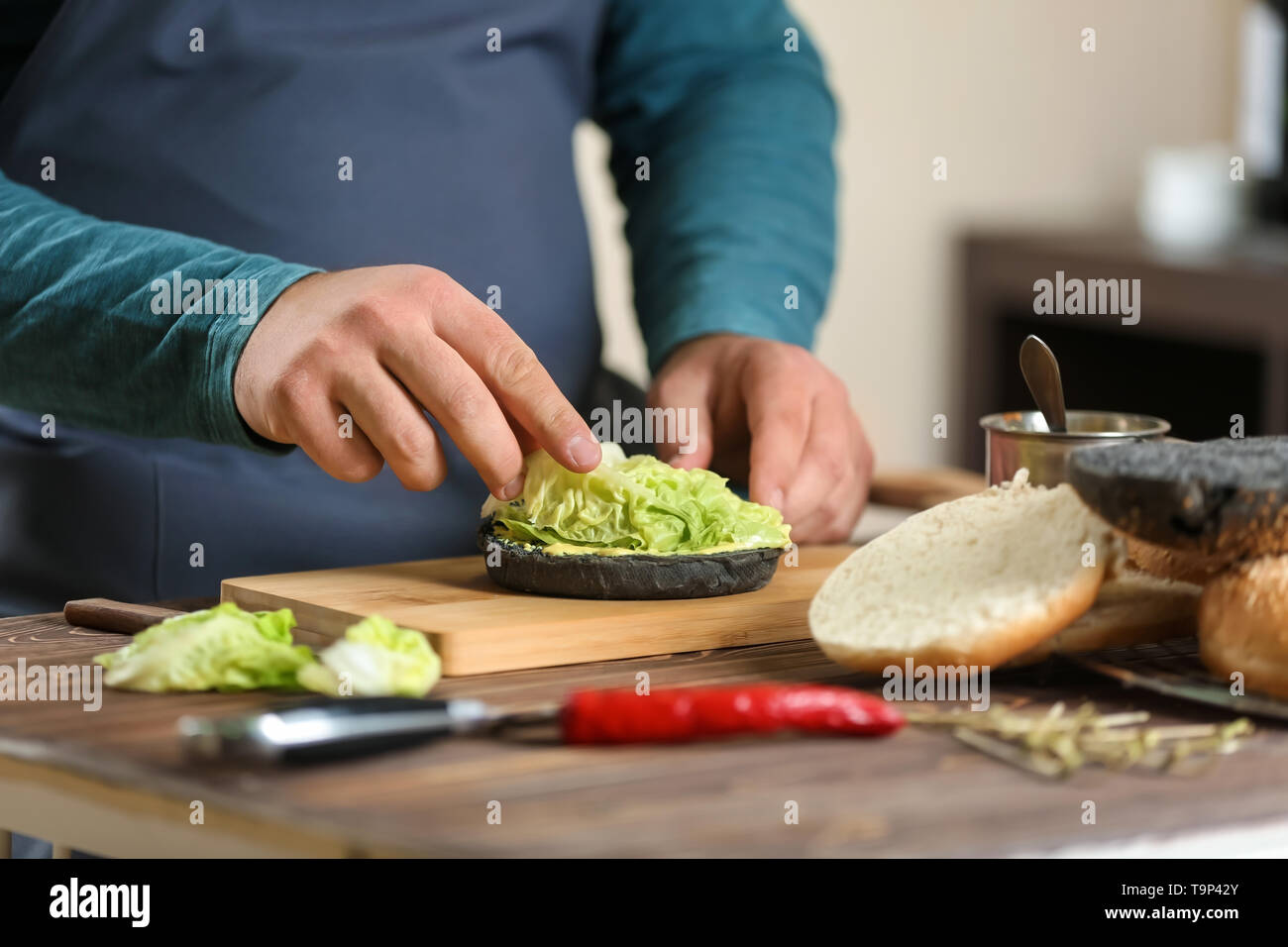 Burger recipe preparing man hi-res stock photography and images - Alamy