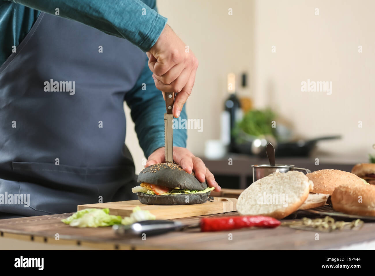 Burger recipe preparing man hi-res stock photography and images - Alamy