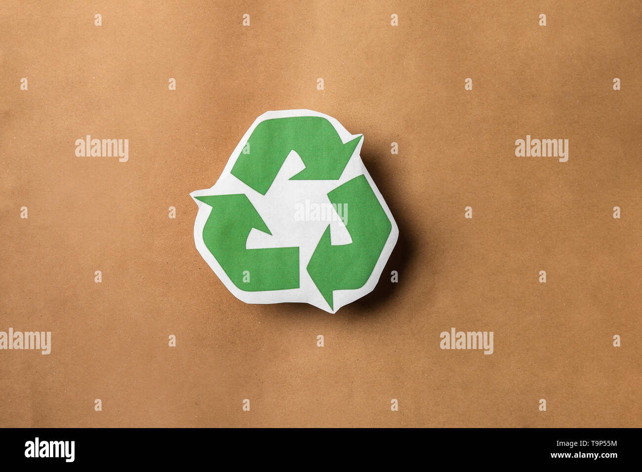 Recycling symbol on brown paper Stock Photo - Alamy