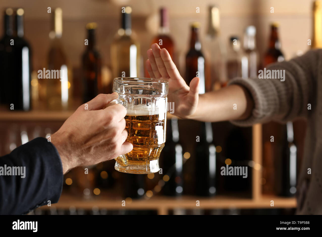Woman rejecting man at bar hi-res stock photography and images - Alamy