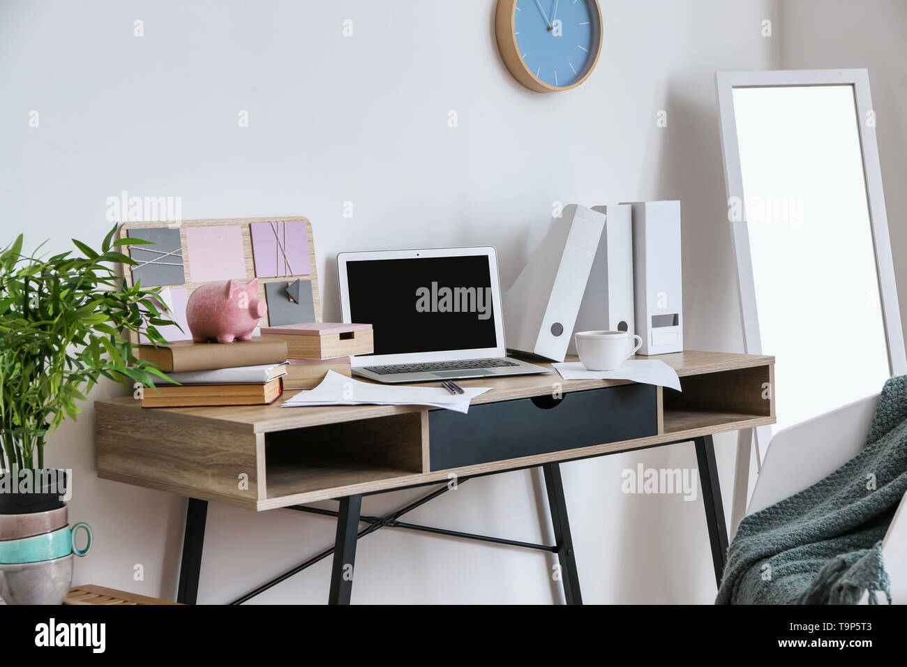 Comfortable workplace with modern laptop in room Stock Photo - Alamy