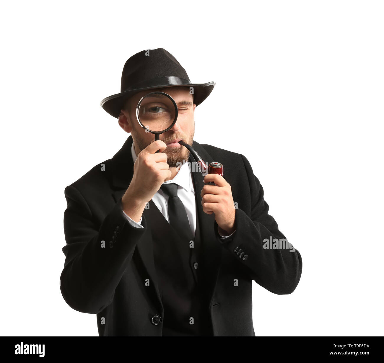 Detective with magnifying glass on white background Stock Photo - Alamy