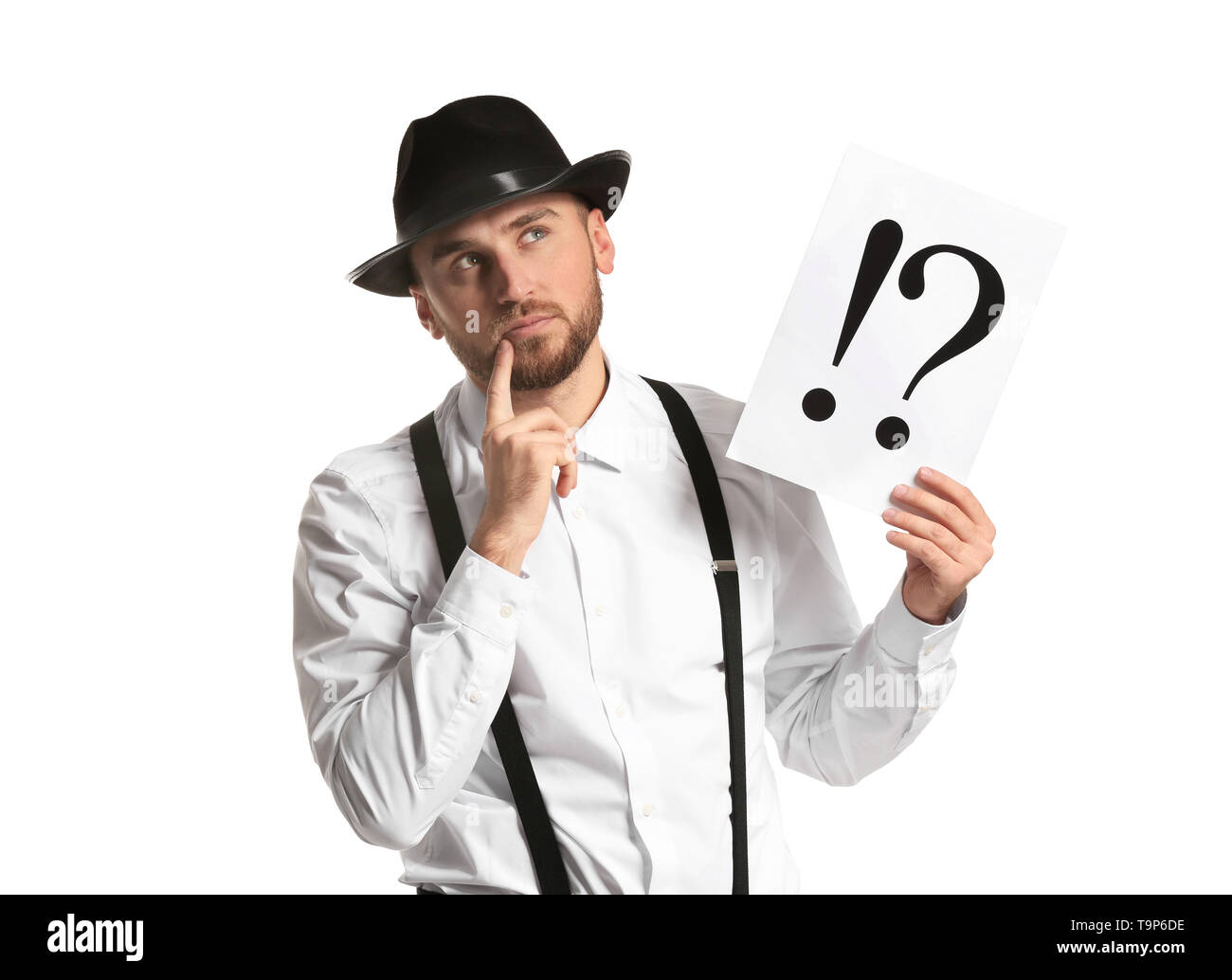 Thoughtful detective holding sheet of paper with exclamation and ...