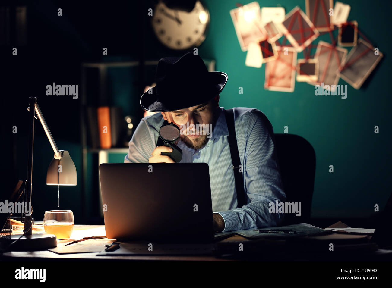 Detective processing evidence in office Stock Photo - Alamy