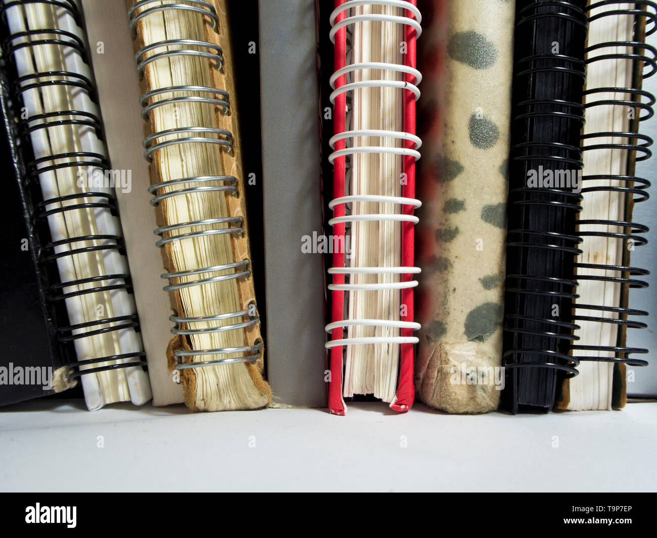 Notebook on shelf Stock Photo - Alamy