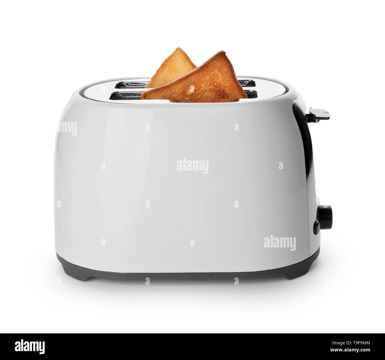 Toaster with bread slices on white background Stock Photo - Alamy
