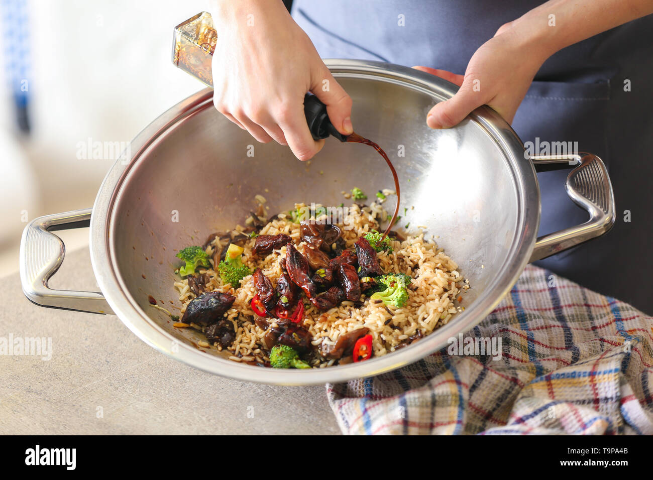 Woman eating rice vegetables in hi-res stock photography and images - Alamy
