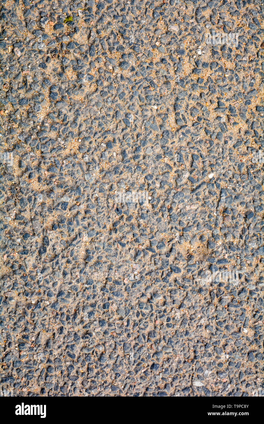 Texture of dirty asphalt with sand. Rough surfaceas as abstract ...