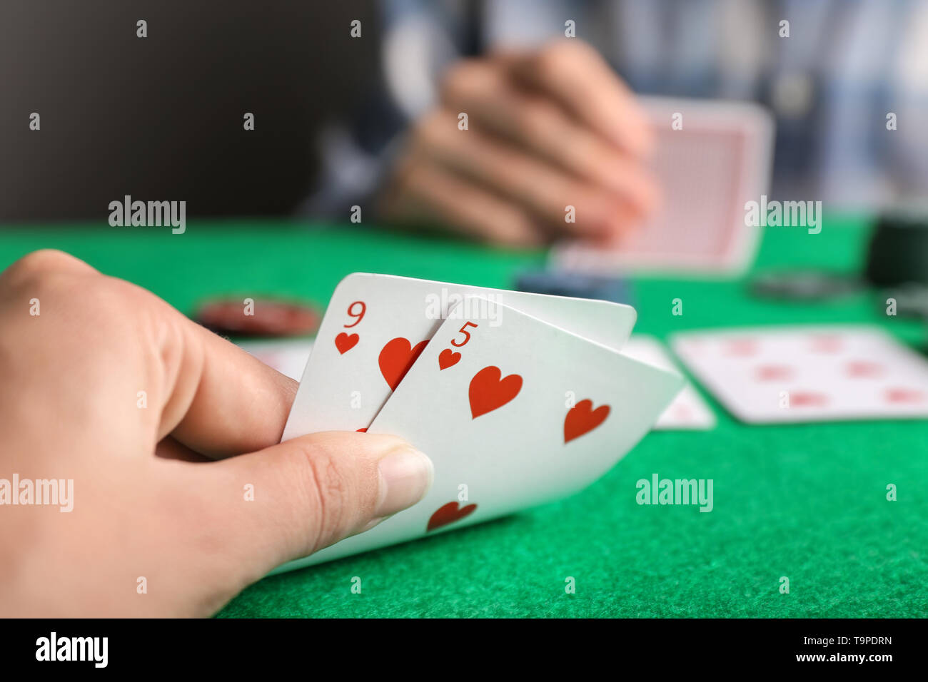 People playing poker table hi-res stock photography and images - Alamy
