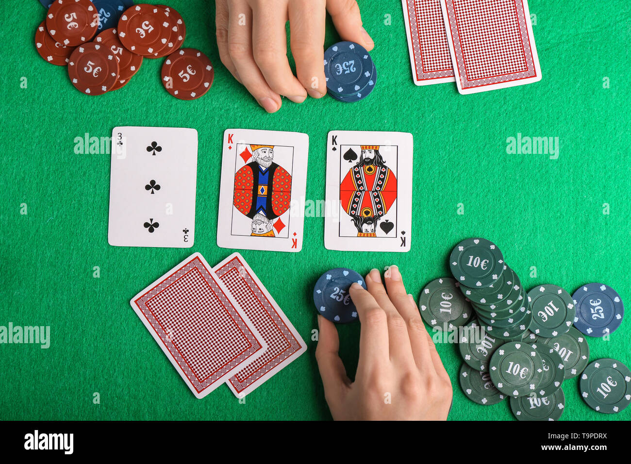 People playing poker table hi-res stock photography and images - Alamy
