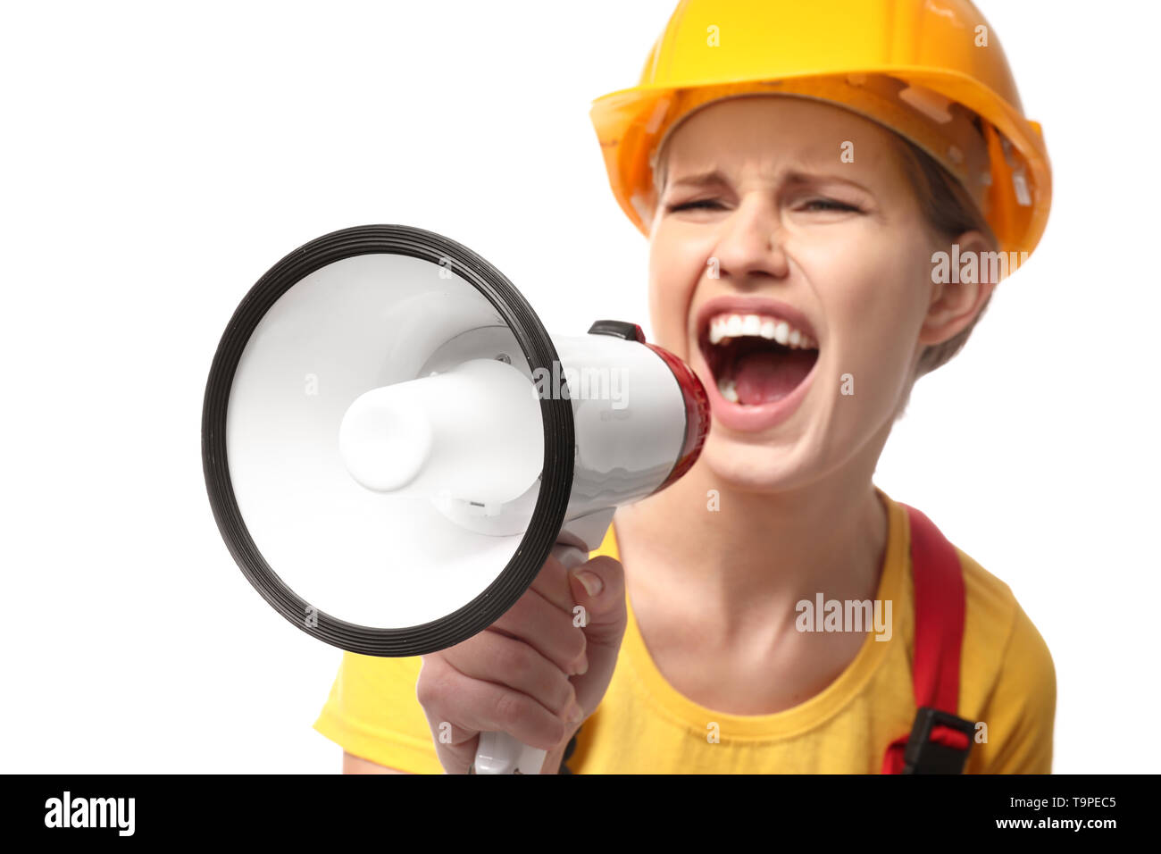 Female engineer with megaphone on white background Stock Photo - Alamy