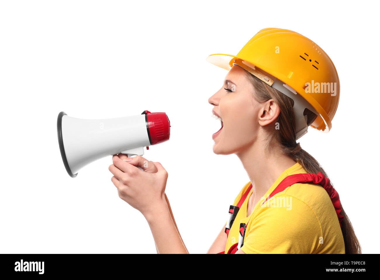 Female engineer with megaphone on white background Stock Photo - Alamy
