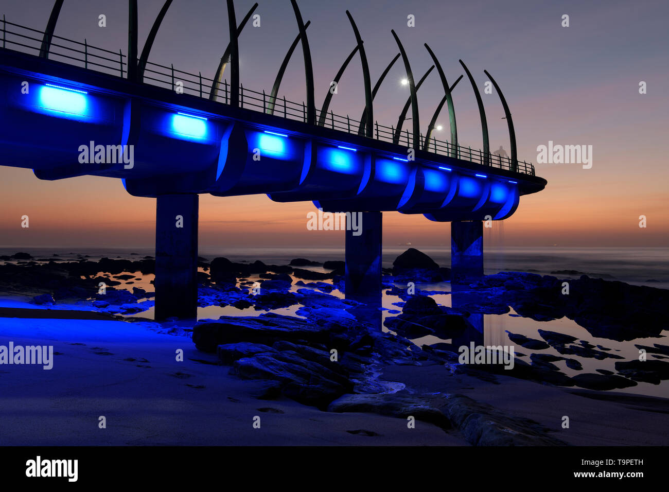 Silhouette of Umhlanga Rocks whale bone pier at dawn, Durban, KwaZulu ...