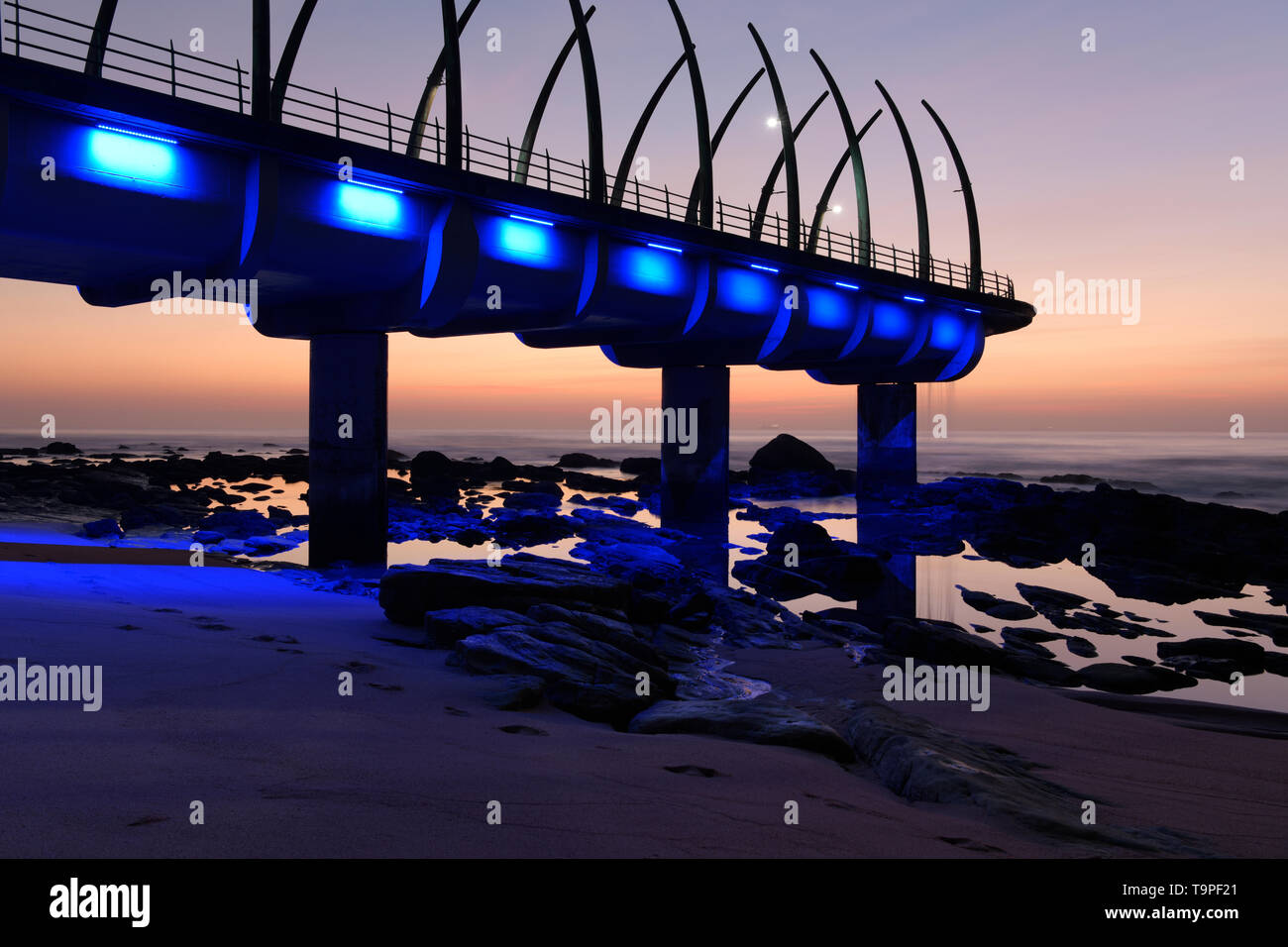 Outline of Umhlanga Rocks whale bone pier at dawn, Durban, KwaZulu ...