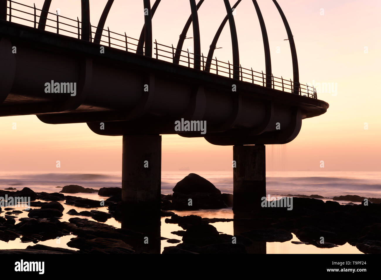 Artistic outline of Umhlanga Rocks whale bone pier at sunrise, Durban ...
