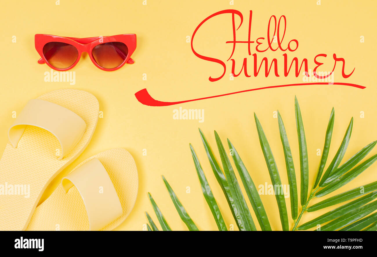 Hello Summer text on yellow background, sandals and sunglasses with ...