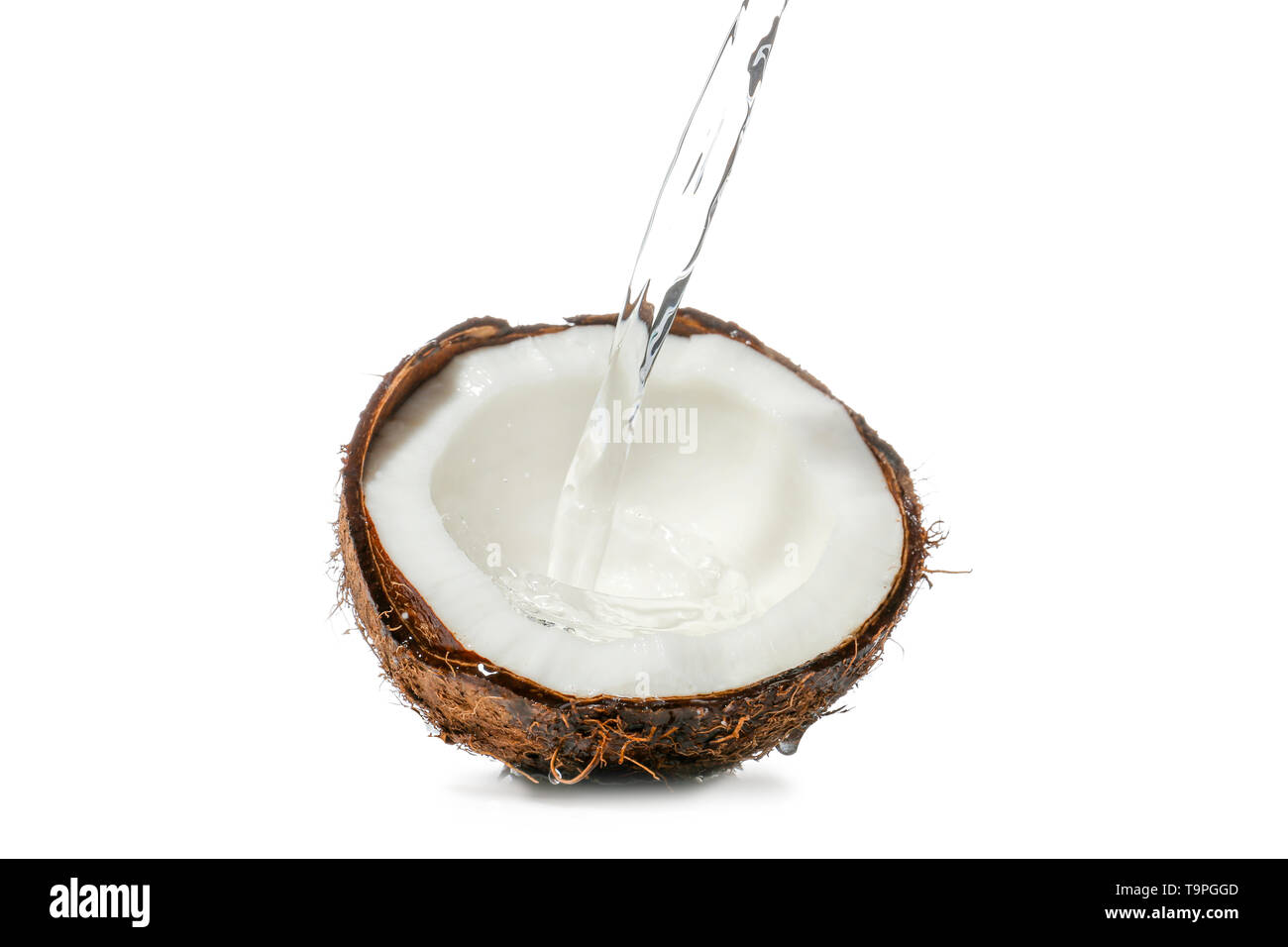 Half of fresh coconut with water splash on white background Stock Photo ...