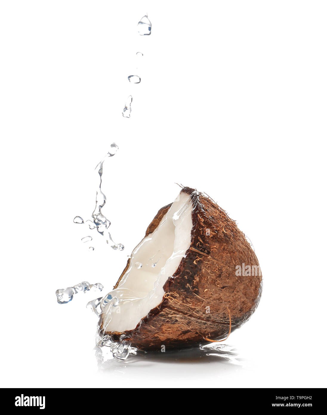 Half of fresh coconut with water splash on white background Stock Photo ...