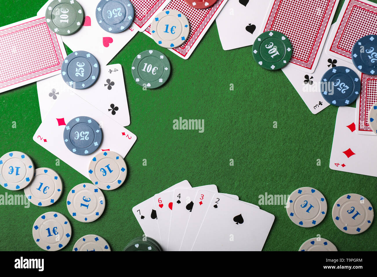 Frame made with chips and cards on green background Stock Photo - Alamy