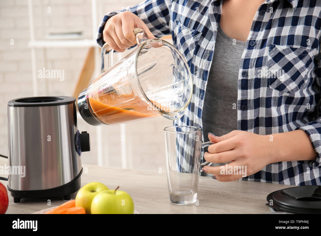 Woman hands pouring smoothie glass hi-res stock photography and images ...