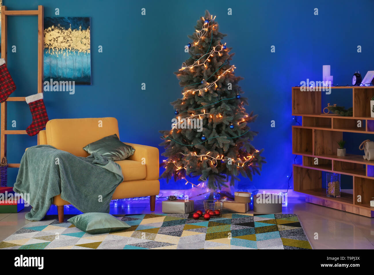 Beautiful fir tree in interior of room Stock Photo - Alamy