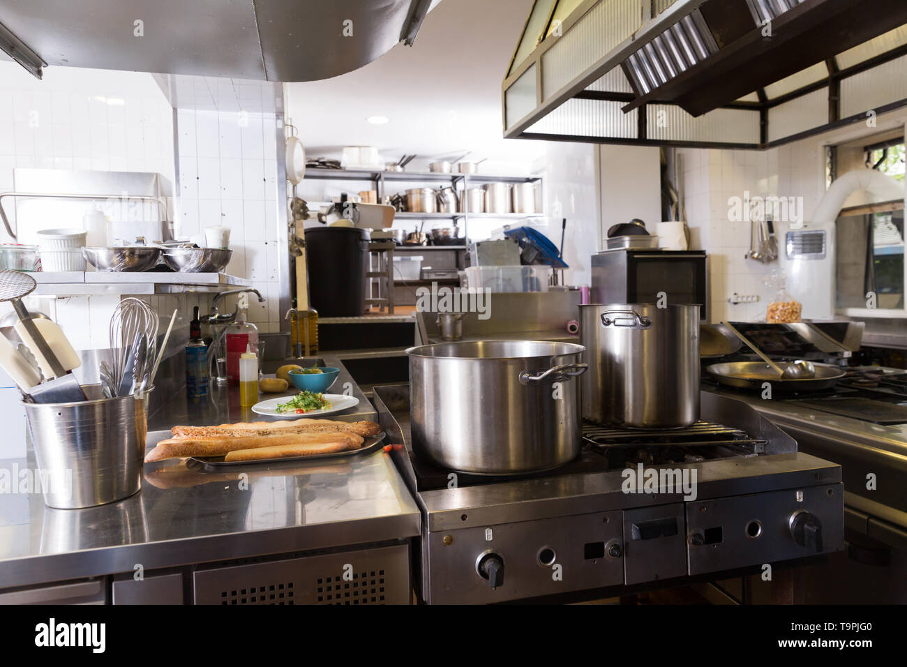 View of empty restaurant kitchen with professional equipment and ...