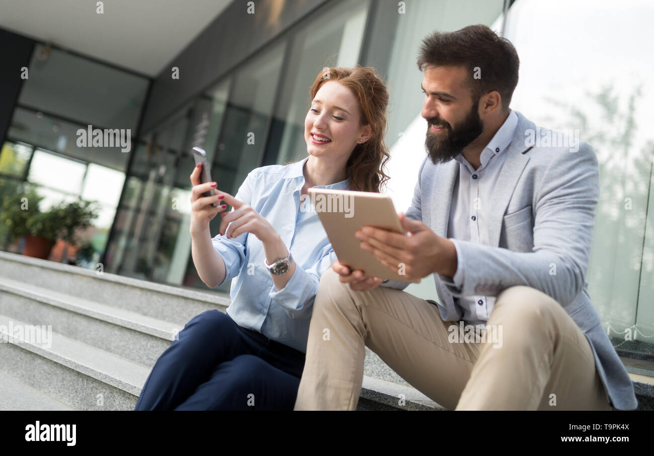 Business people discussing ideas outside Stock Photo - Alamy