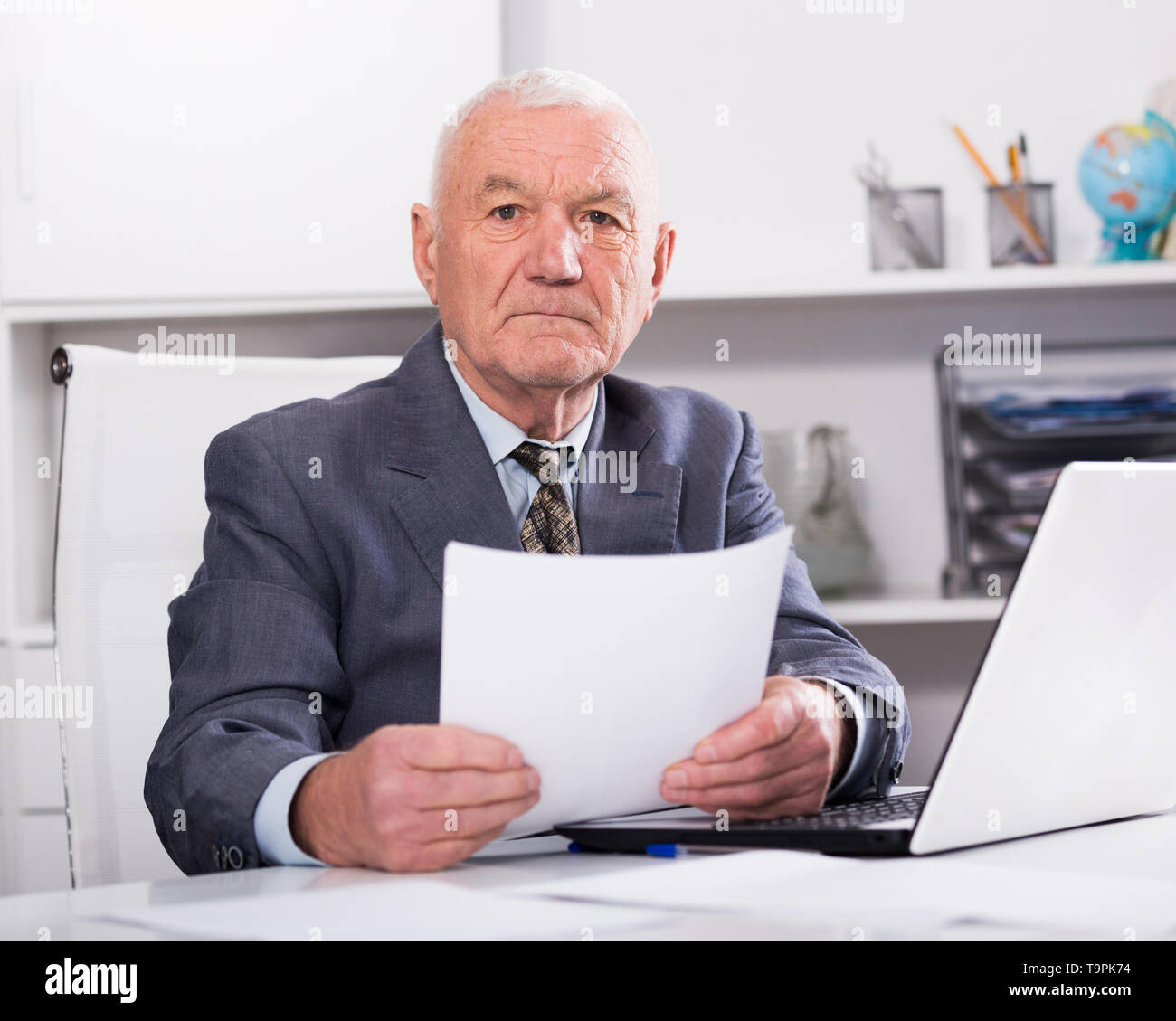 Smiling man worker working effectively on project in office Stock Photo ...