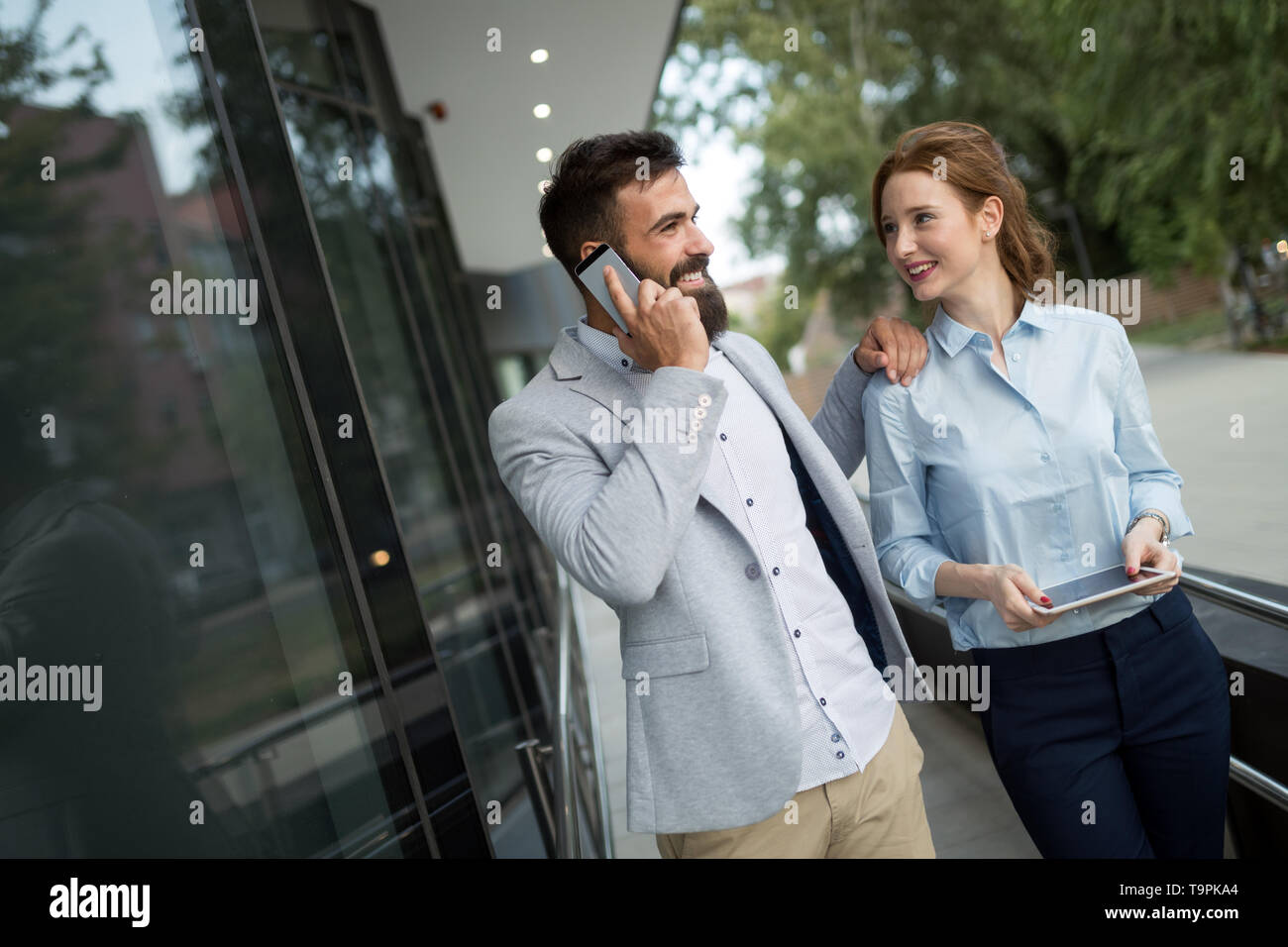 Business people discussing ideas outside Stock Photo - Alamy