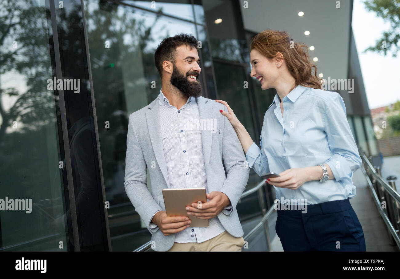 Young business people talking and cooperating together Stock Photo - Alamy