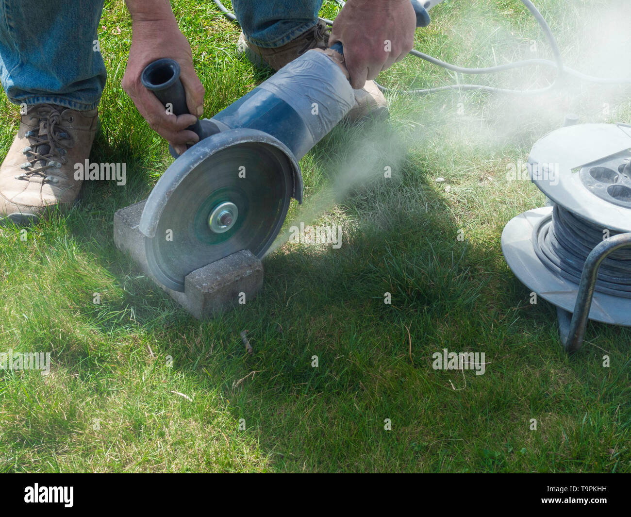 stone masonry concept, close up of cutting sandstone by industrial ...