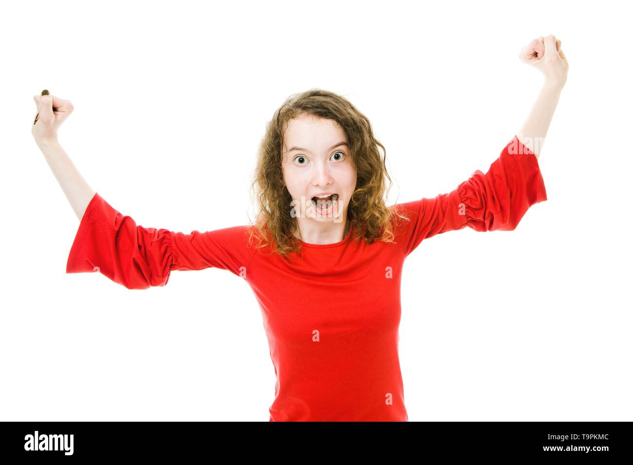 Excited girl in red rising up hands - happy celebrating Stock Photo - Alamy