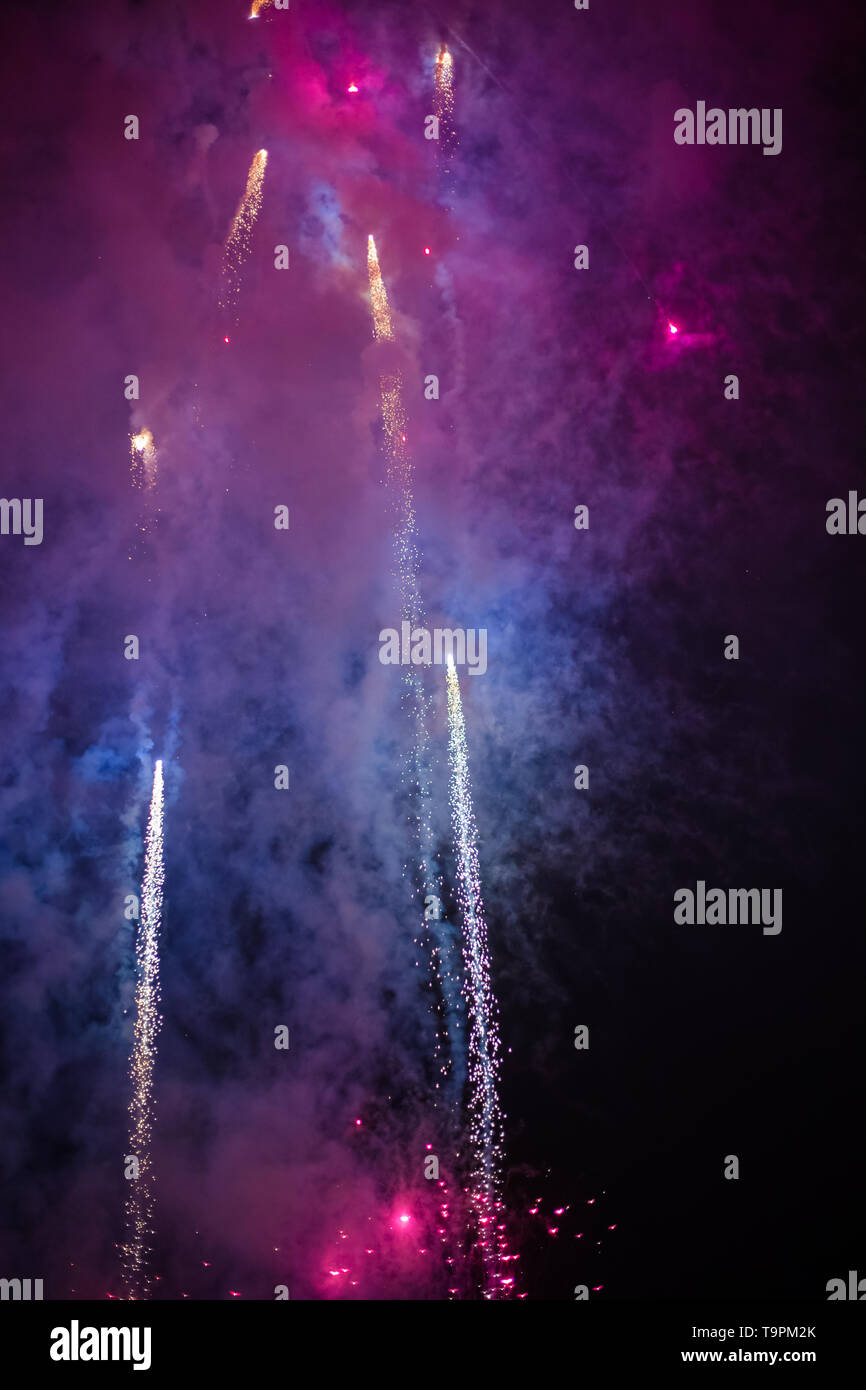 Explosive and colorful holiday fireworks at night sky. Celebration City ...