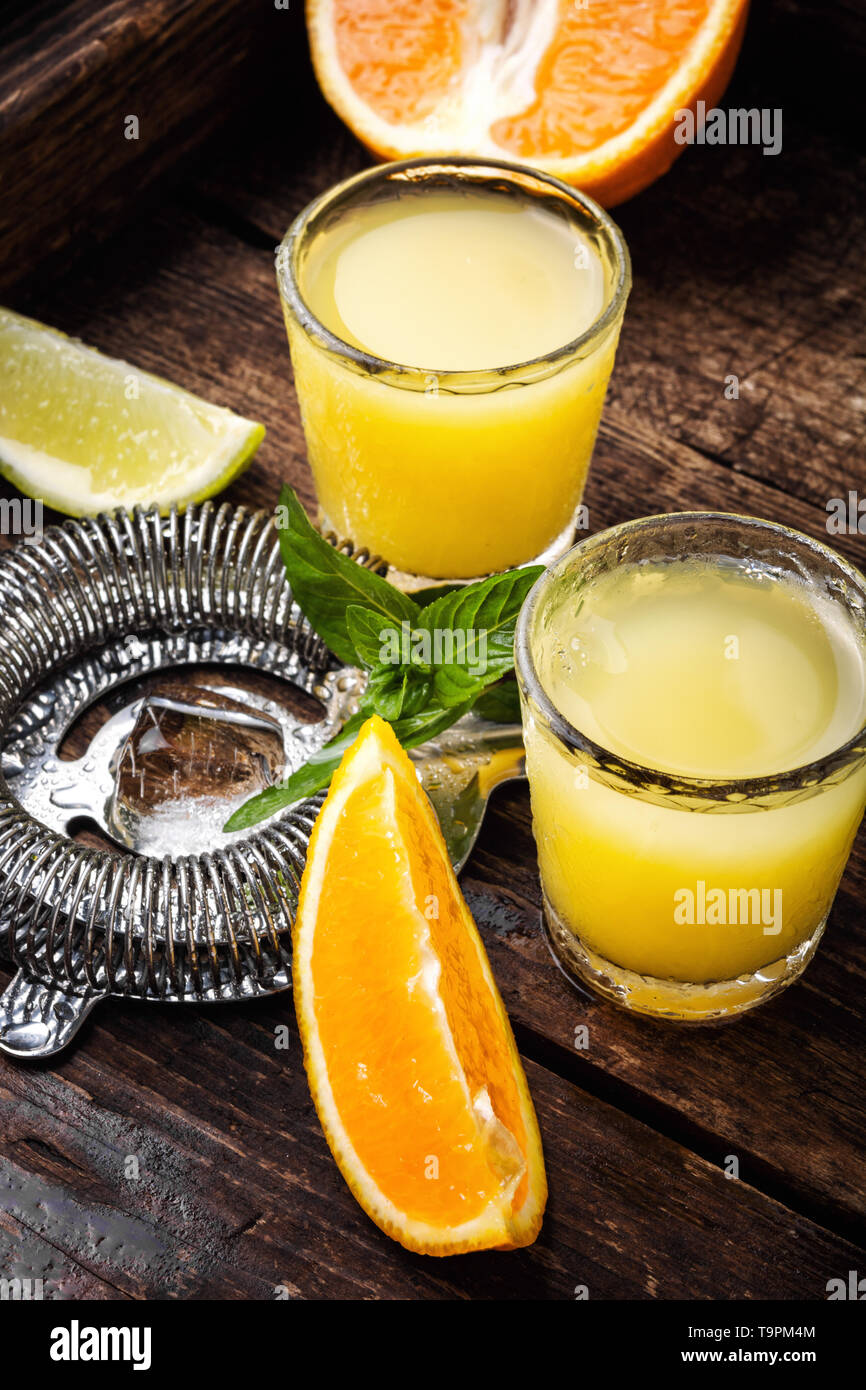 Glass of orange drink.Alcoholic drinks on rustic wood background.Drink ...