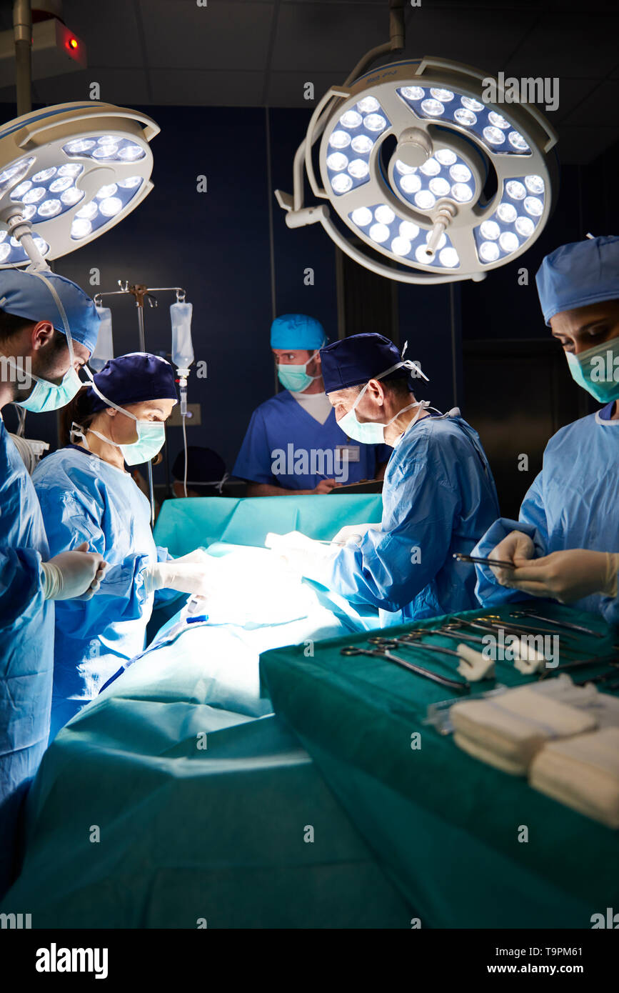 Dark operating room and surgeons Stock Photo - Alamy