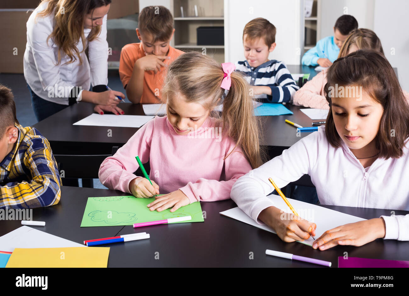happy american children of elementary age having class of art Stock ...