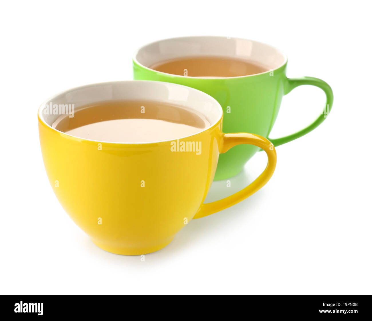 Cups of hot tea on white background Stock Photo - Alamy