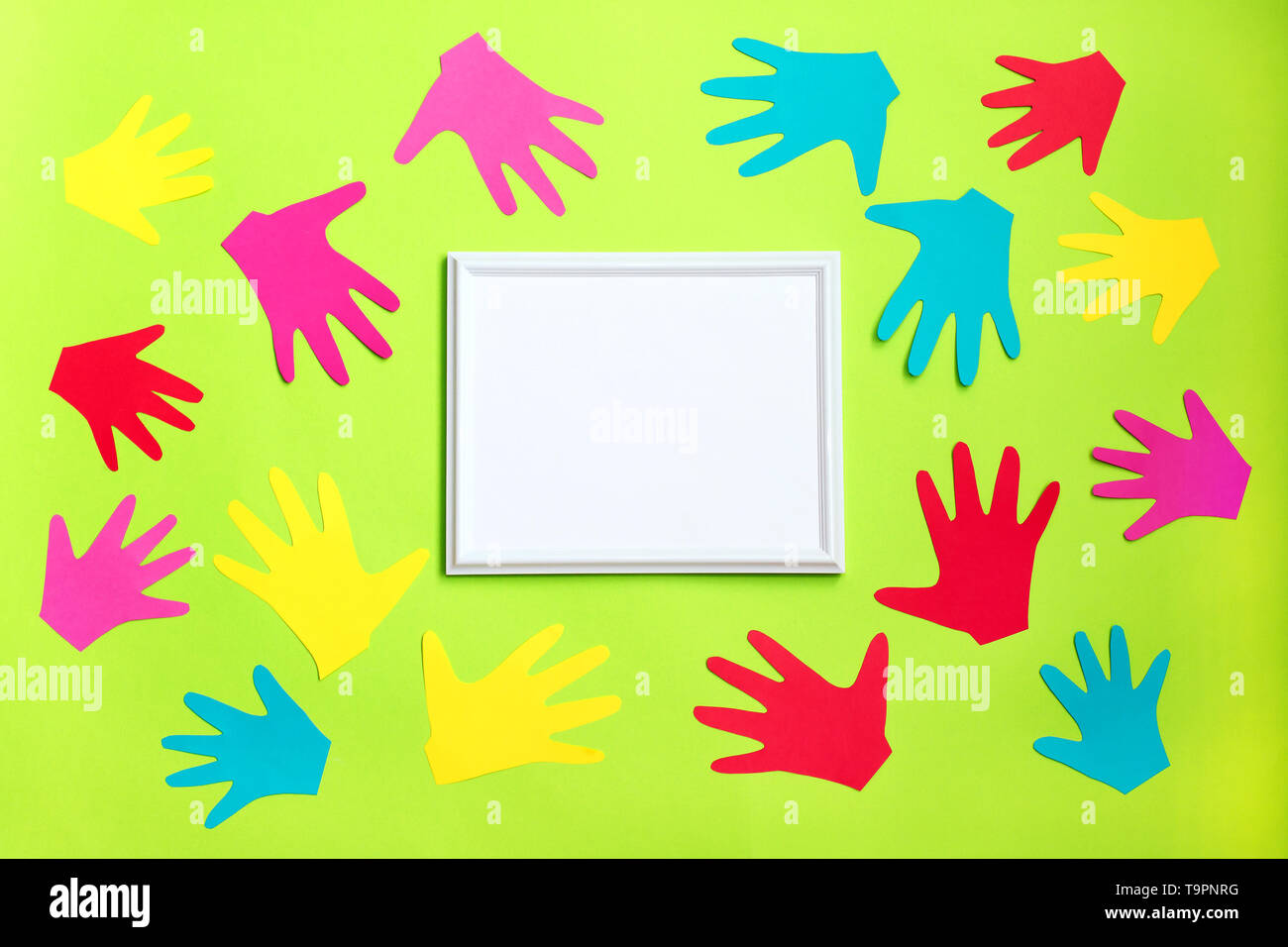 AUTISM. Cut out of colored paper children palms around white frame on ...