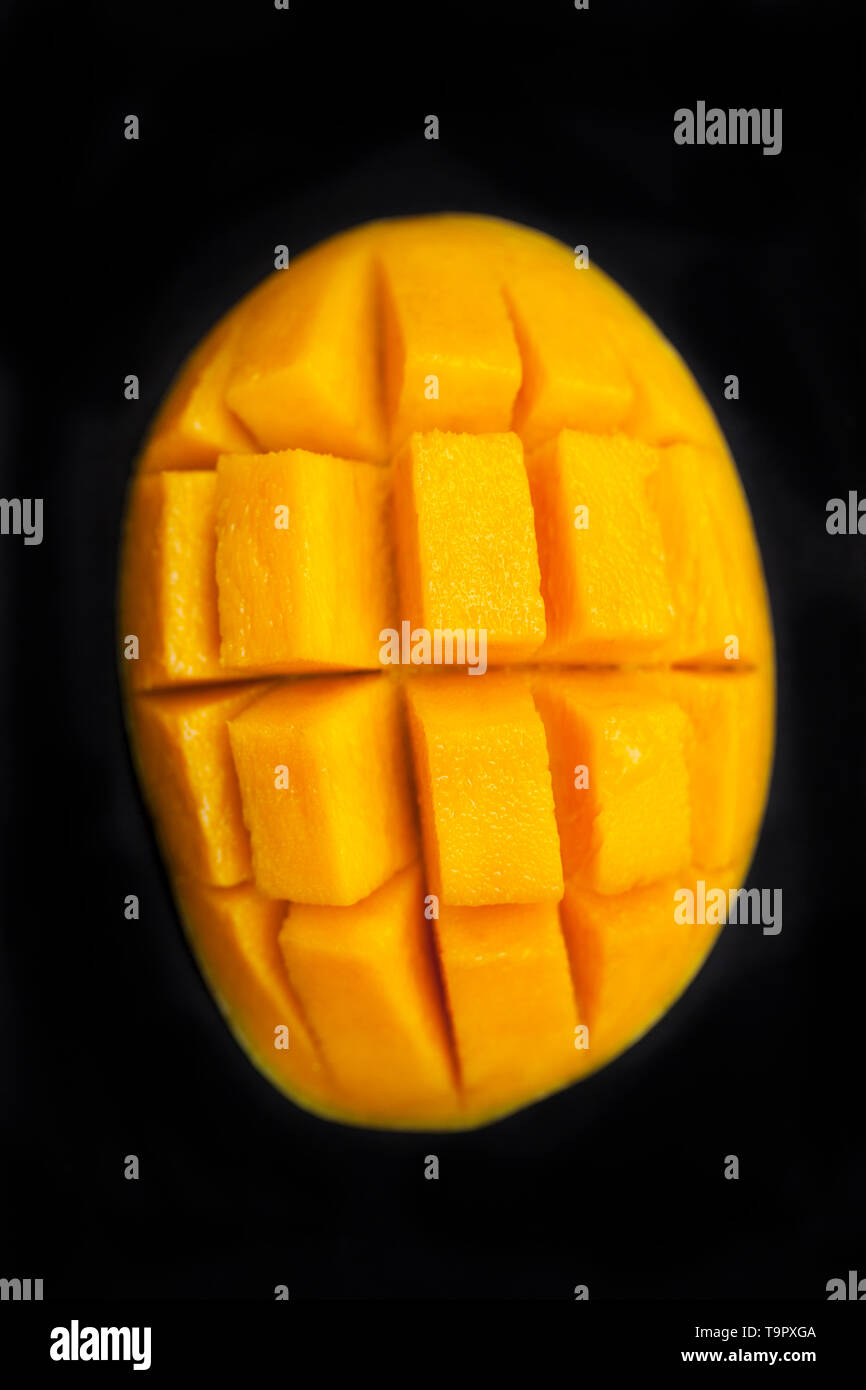Fresh mango organic product. Dark background. Close up. Top view Stock ...