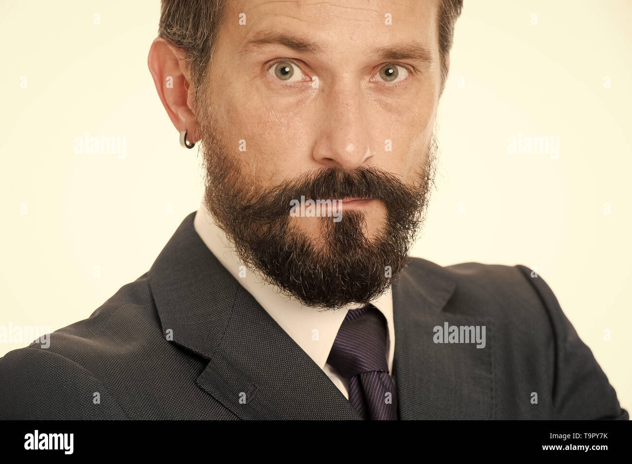 Mature and experienced. Male face calm confident with beard and ...